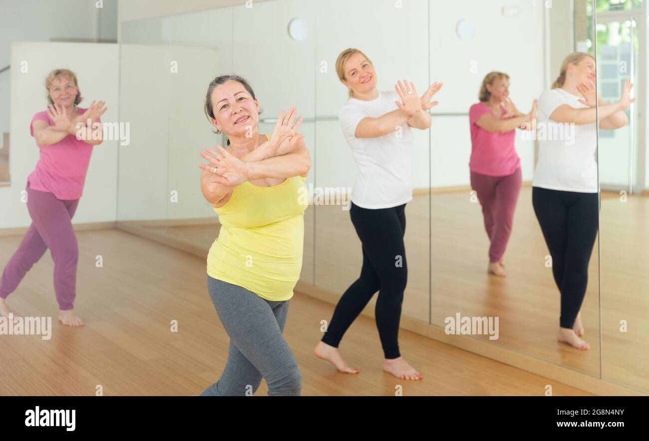 Mature women training at group dance class Stock Photo - Alamy