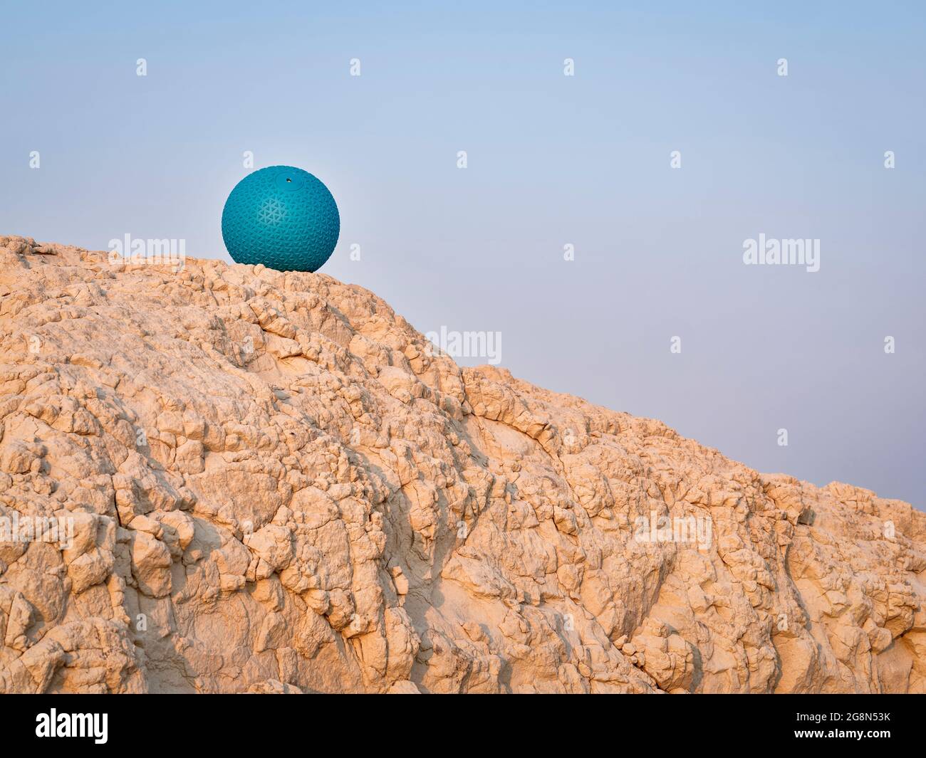 heavy rubber slam ball filled with sand on at a clay cliff, outdoor ...