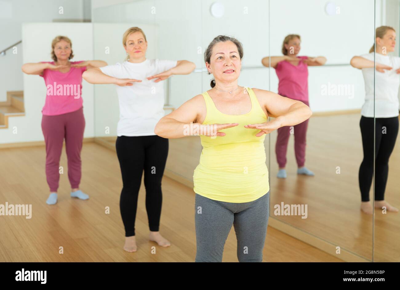 Adults training swing steps at dance class Stock Photo - Alamy