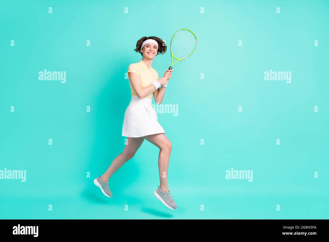 Full Size Photo Of Happy Cheerful Good Mood Girl Jumping Playing Tennis