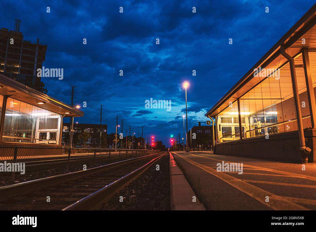 the train station at night 2 ways Stock Photo - Alamy