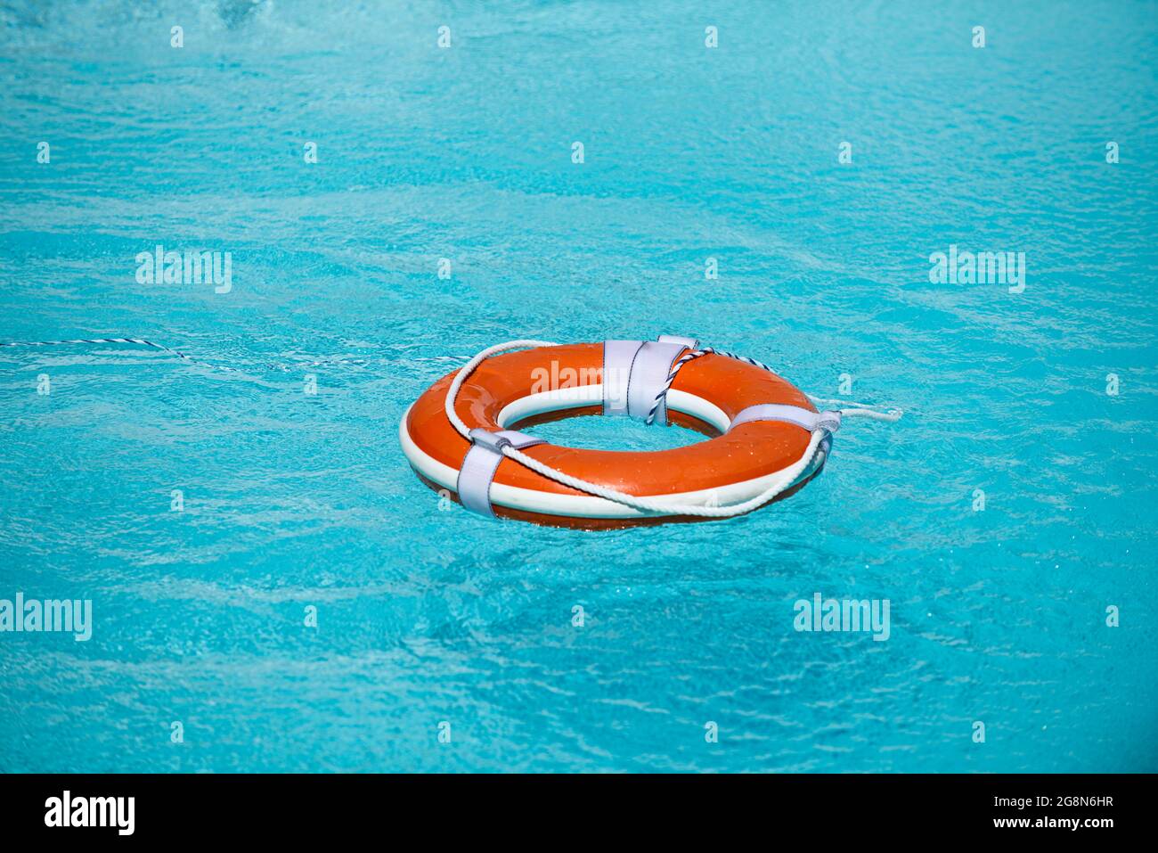 Lifebuoy in swimming pool. Summer vacation concept. Life buoy in water ...