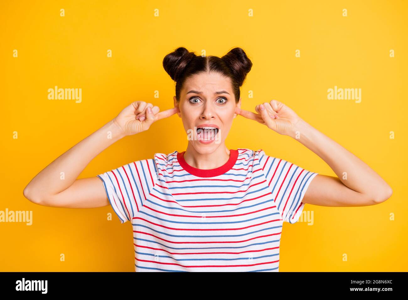 Photo of scared brunette lady hands ears wear colorful t-shirt isolated ...
