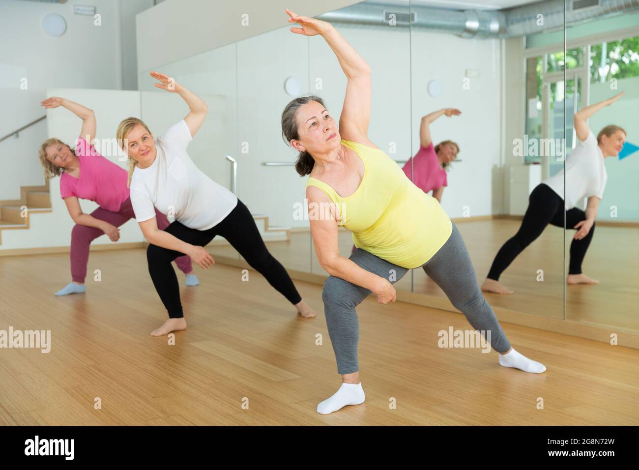 Mature women dancing aerobics at lesson in dance class Stock Photo - Alamy