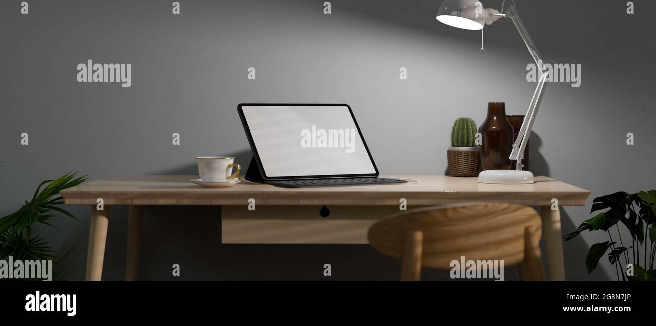 Work space at home, late night working, low light office, laptop in ...