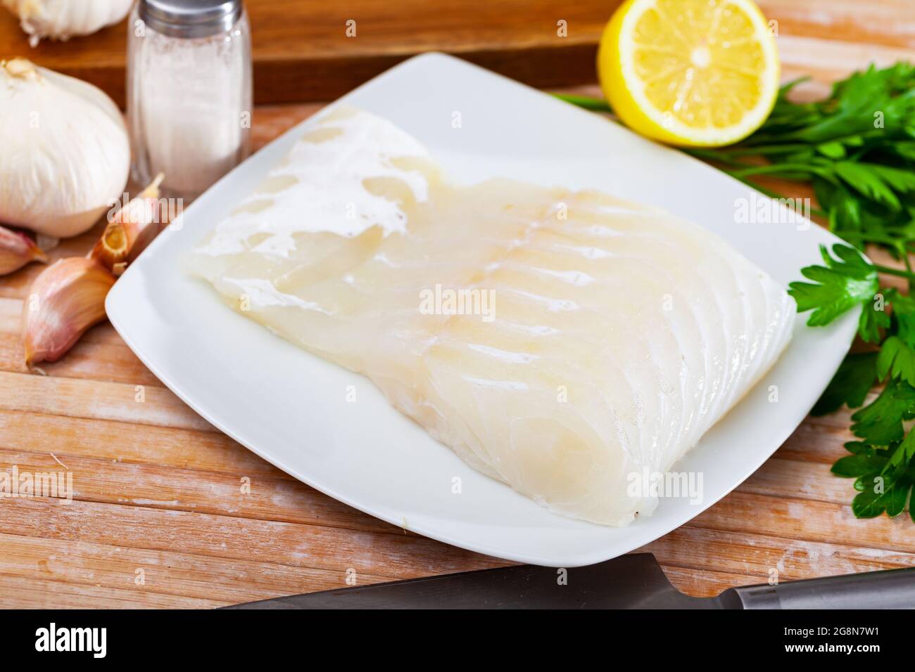 Raw pink cusk-eel fish fillet, seafood ingredients Stock Photo - Alamy