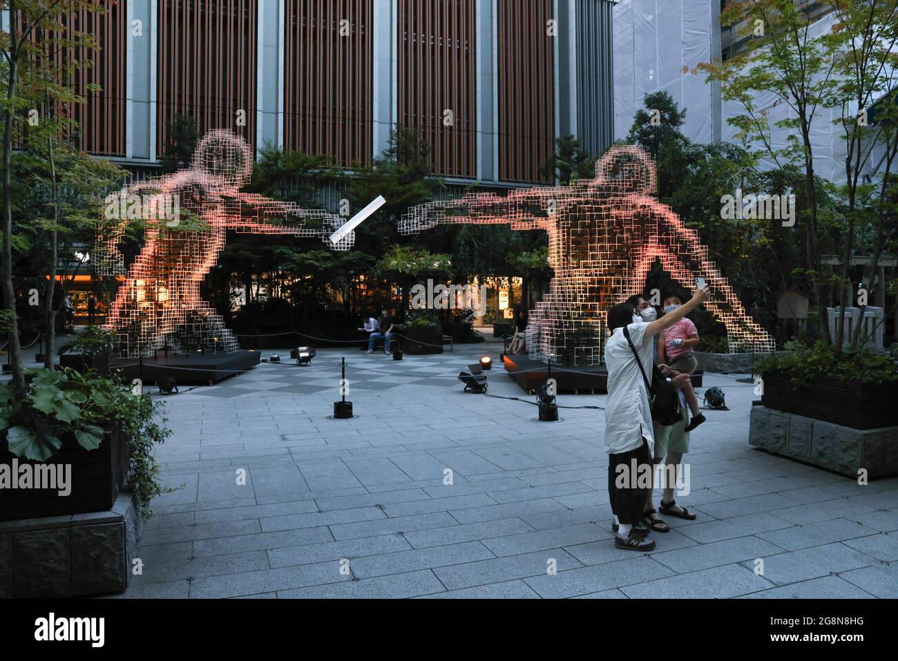 Tokyo, Japan. 21st July, 2021. People take a selfie in front of ...