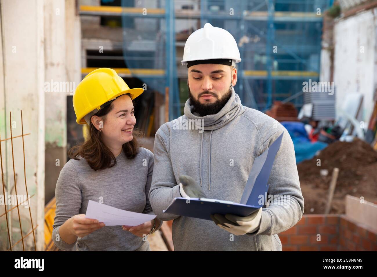 Engineers inspecting process of building overhaul Stock Photo - Alamy