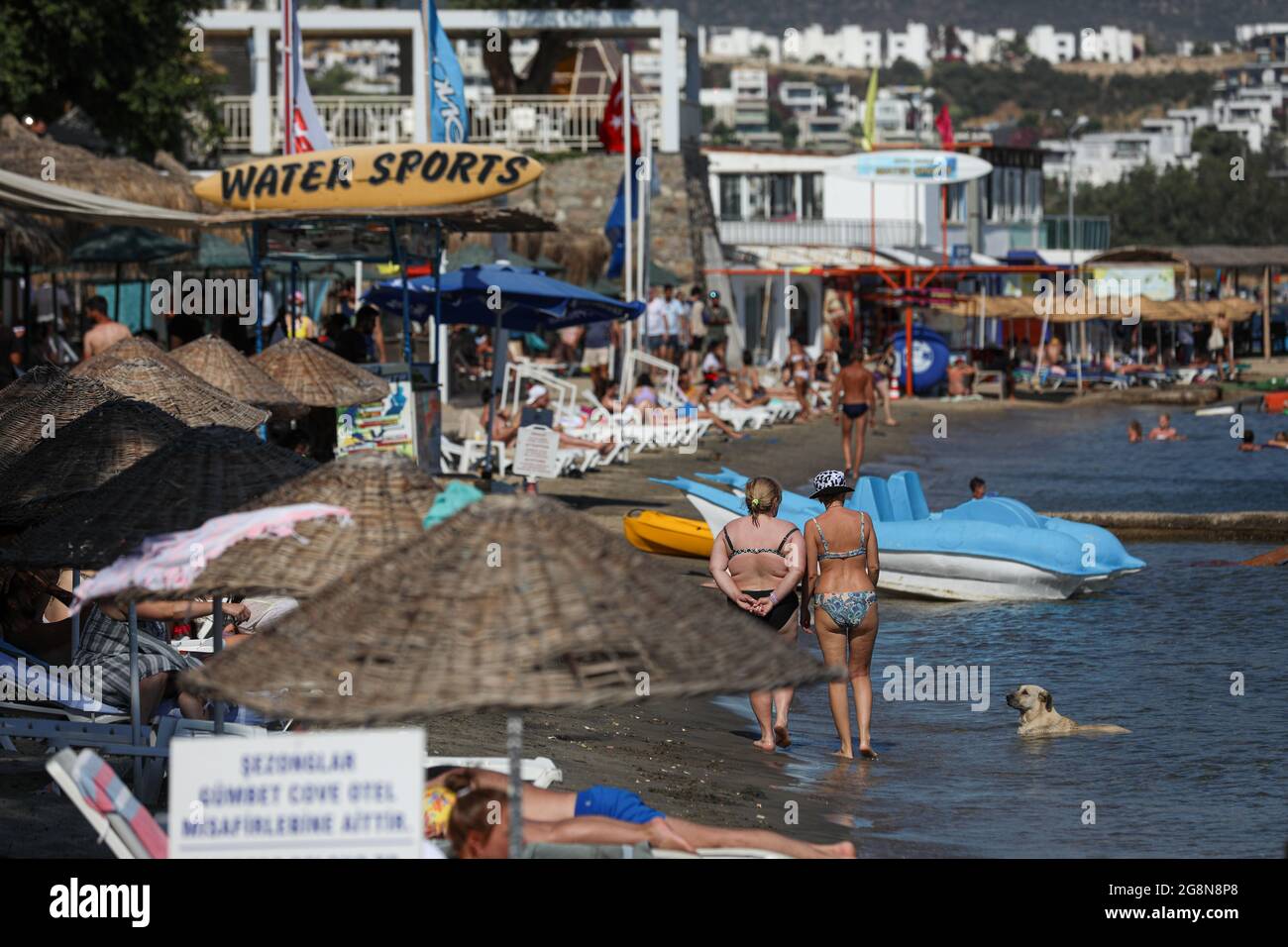 People enjoy the sun and the warm weather at Bodrum beach.One of most ...