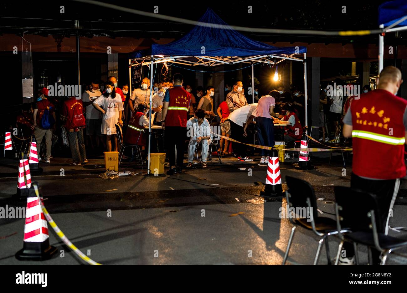 Nanjing City, China. July 21 2021: Citizens line up to receive a Covid ...