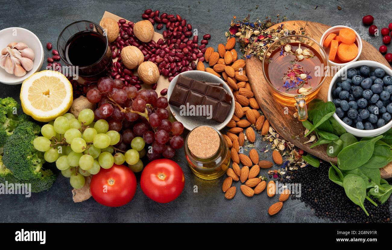 Selection of healthy food high in antioxidants on dark gray background ...
