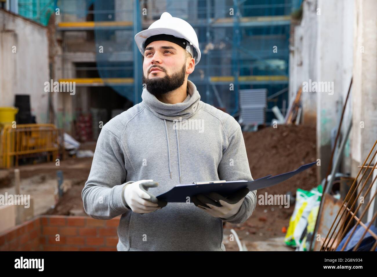 Supervisor inspecting process of building overhaul Stock Photo - Alamy