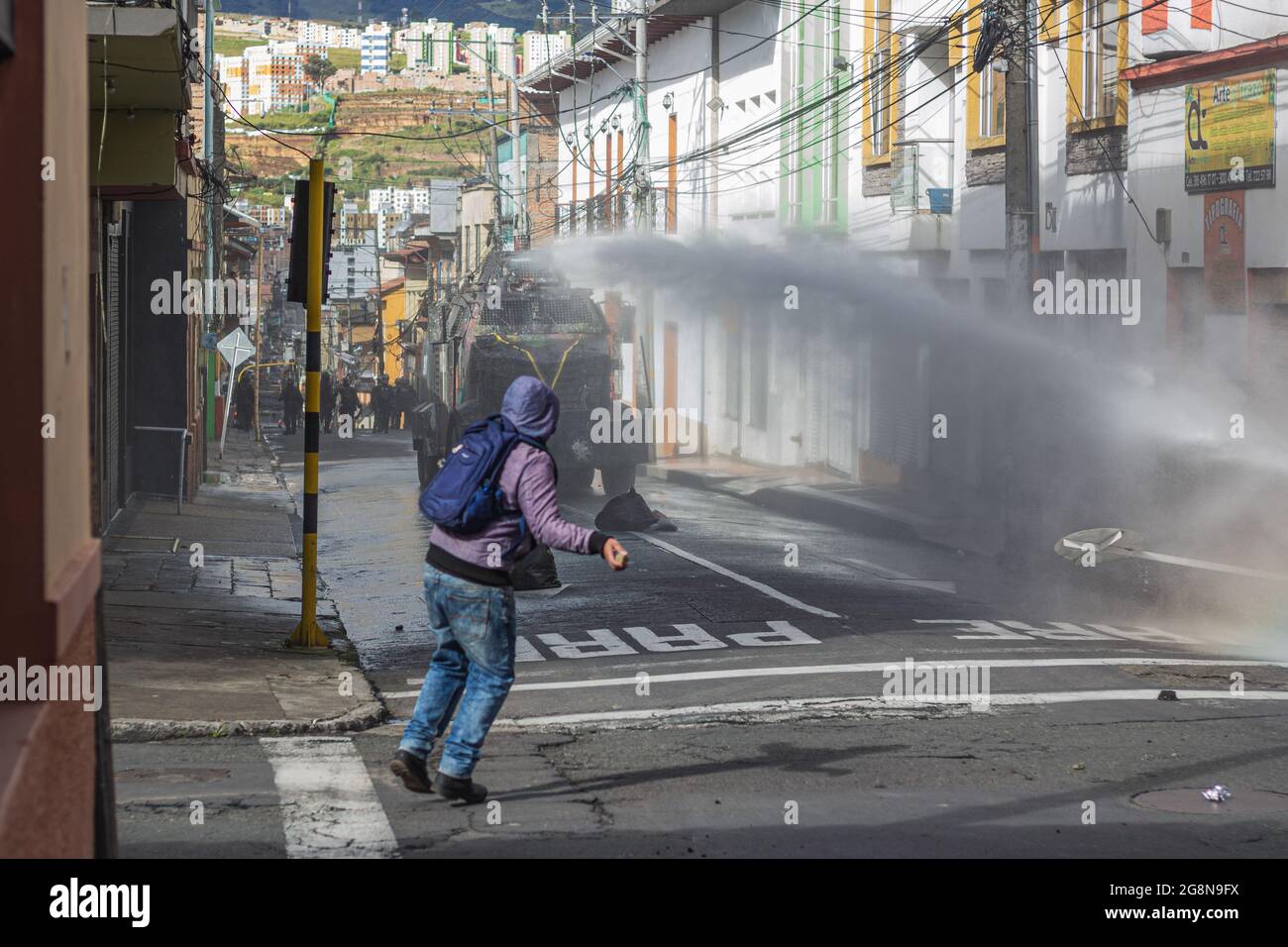 A demonstrator throwing rocks at a Riot Armored truck during a new day ...