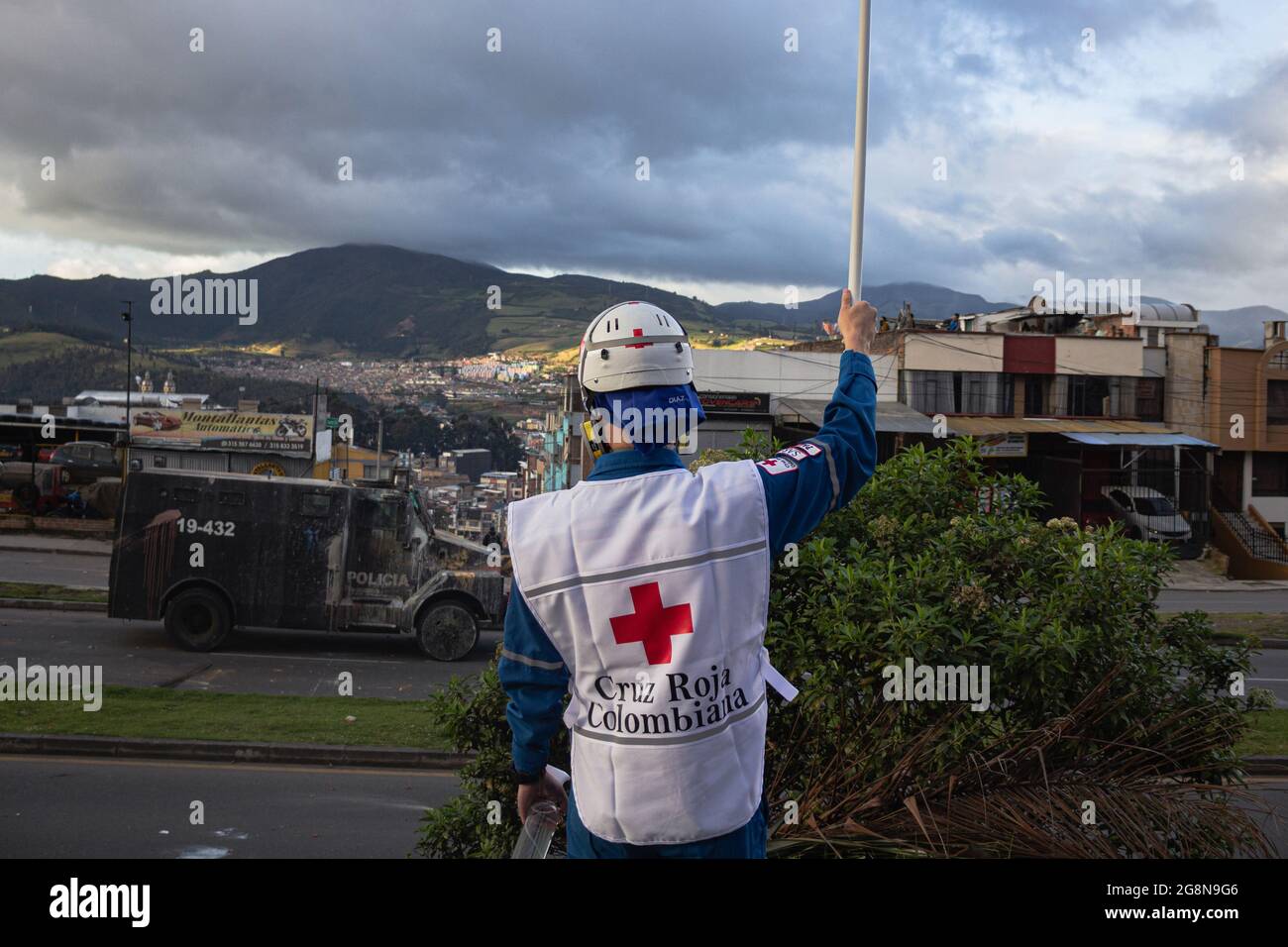 A Red Cross member waves a Red Cross flag during a new day of anti ...