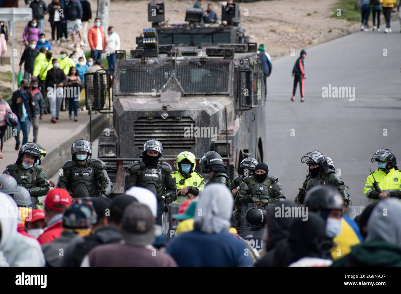 A riot armored truck stays behind Colombia's riot police during a new ...