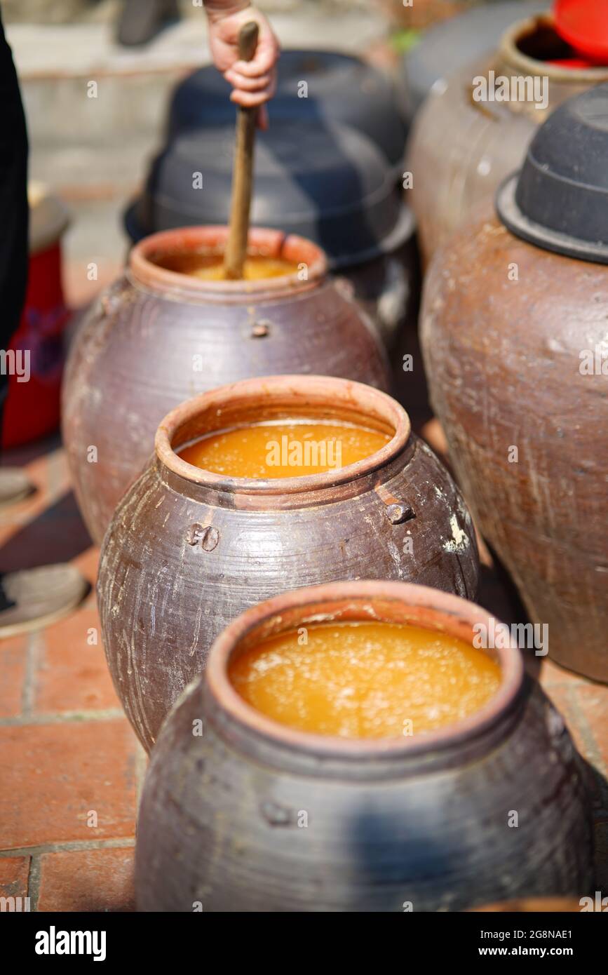 Soya sauce jar container in the yard northern vietnam Stock Photo - Alamy