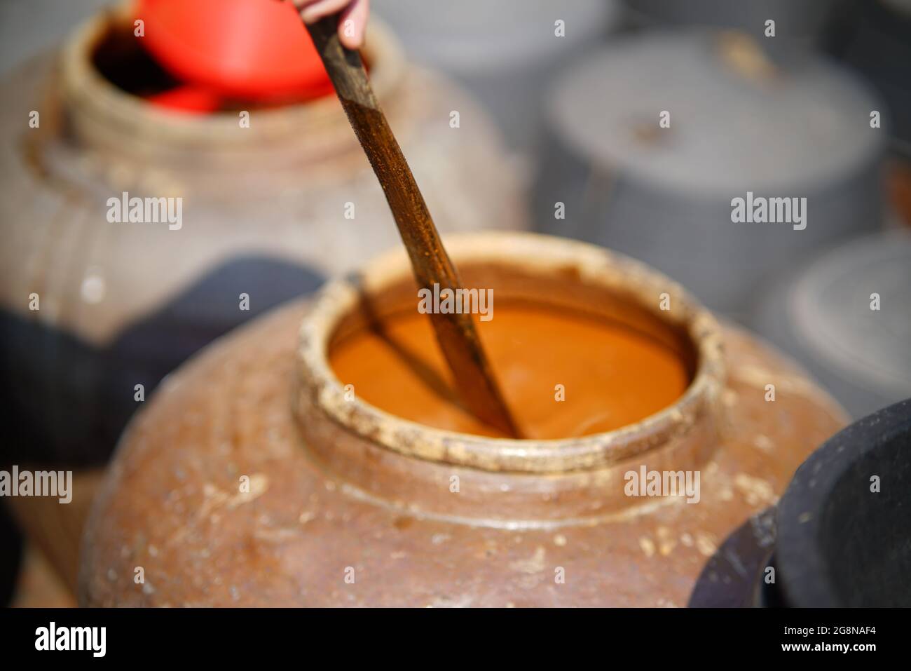 Soya sauce jar container in the yard northern vietnam Stock Photo - Alamy
