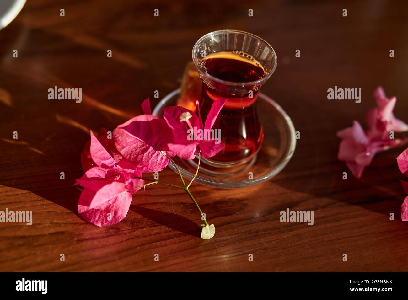 Turkish delight and traditional glass of turkish tea with bougainvillea ...