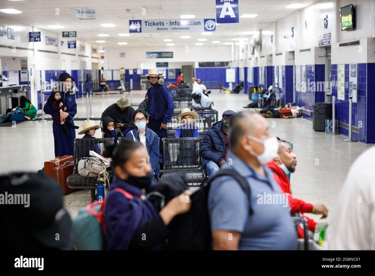 Columbus, United States. 14th July, 2021. Greyhound passengers stand in ...