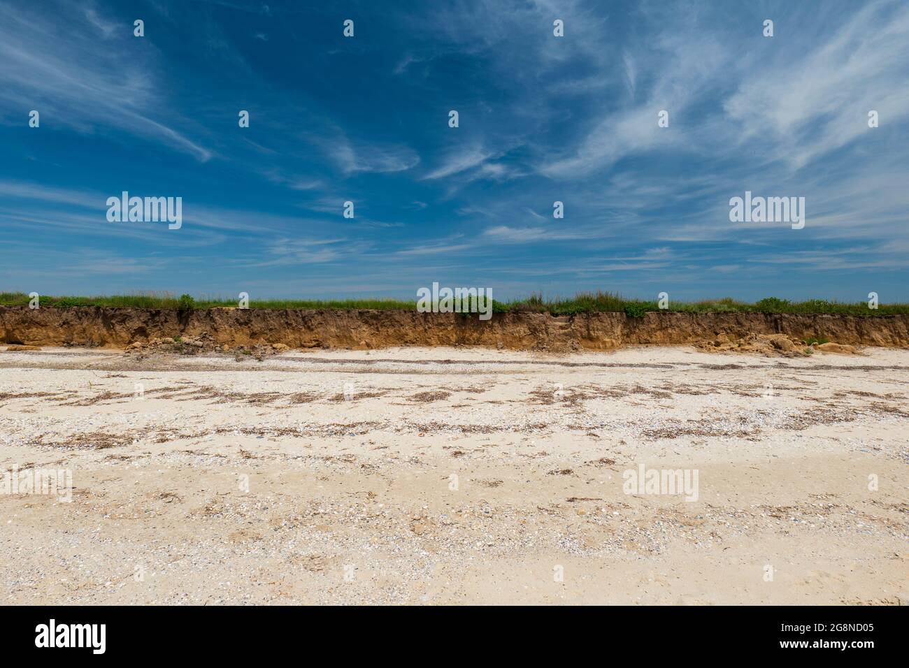 View across the sea beach to the canyon. Beautiful blue sky. Summer ...