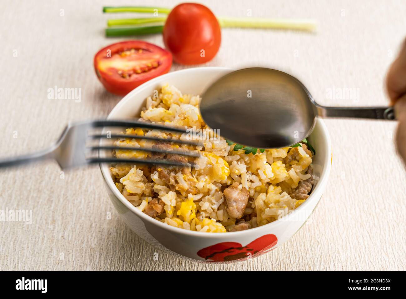 Man hand using metal spoon and fork scoop delicious thai style homemade ...