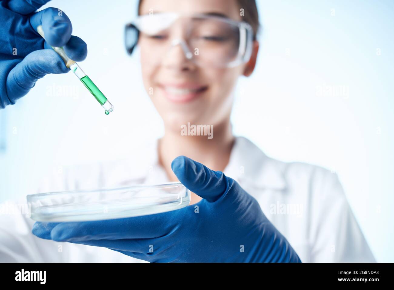 female laboratory assistant chemical solution research biotechnology ...
