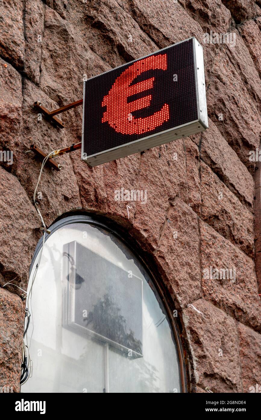 Euro sign on digital tableaux outside historical building in central ...