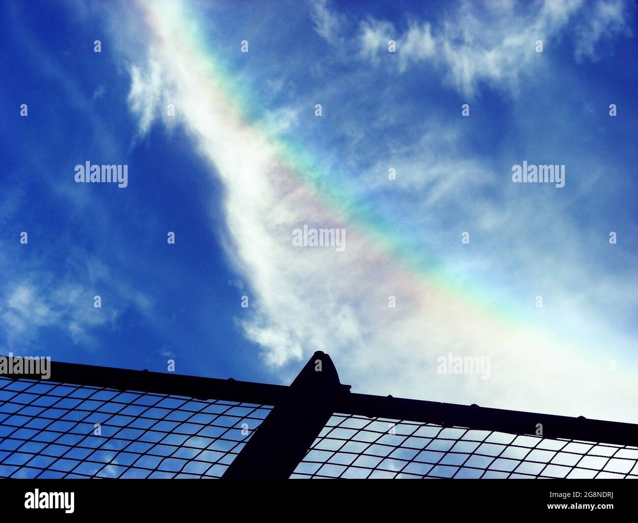 Zenith Rainbow and Blue Sky Stock Photo - Alamy
