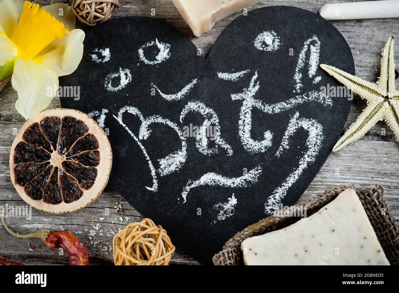 Spa background with chalk board, organic soap, weathered wooden table ...