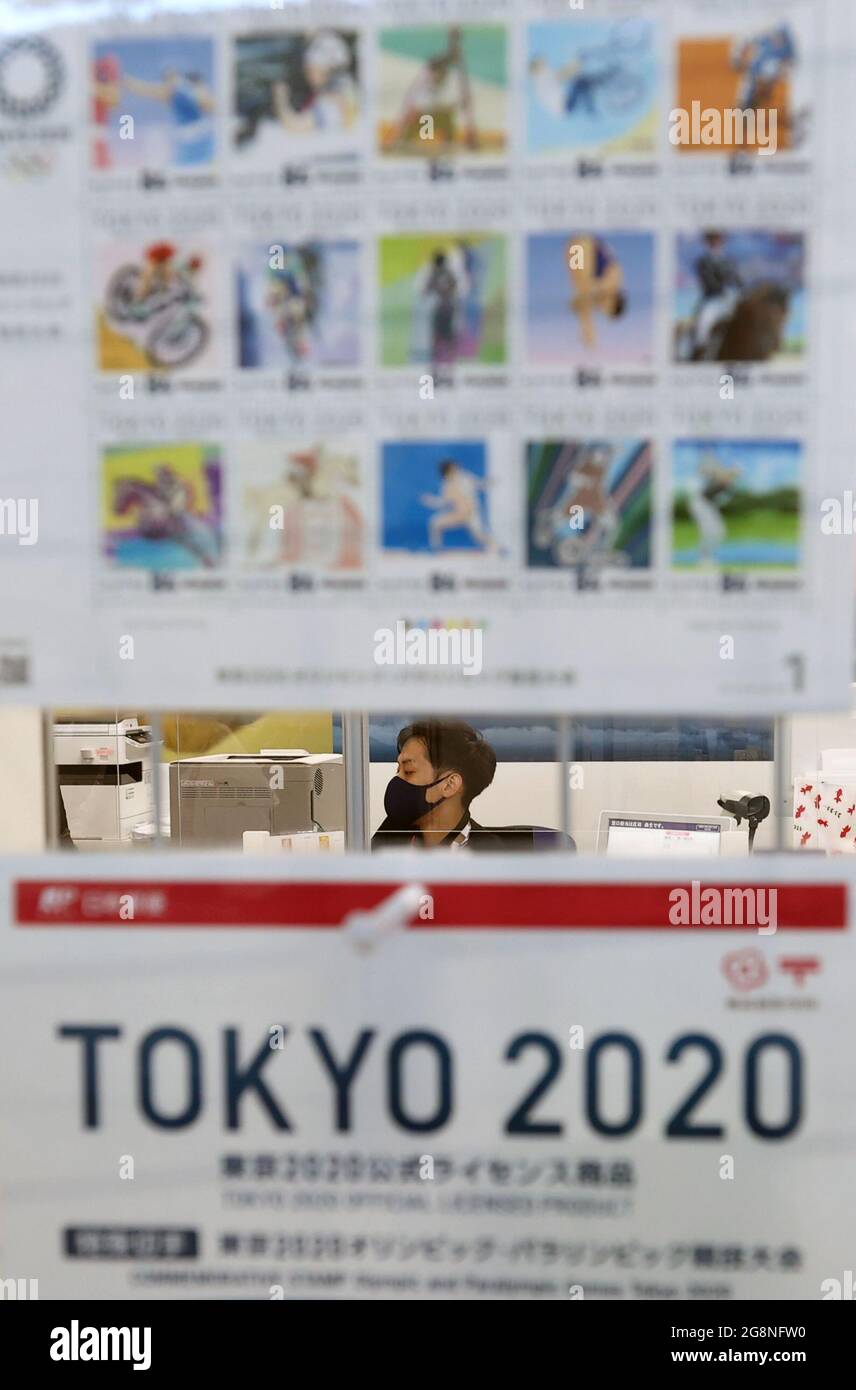 Tokyo, Japan. 22nd July, 2021. A staff member works at a post office at ...