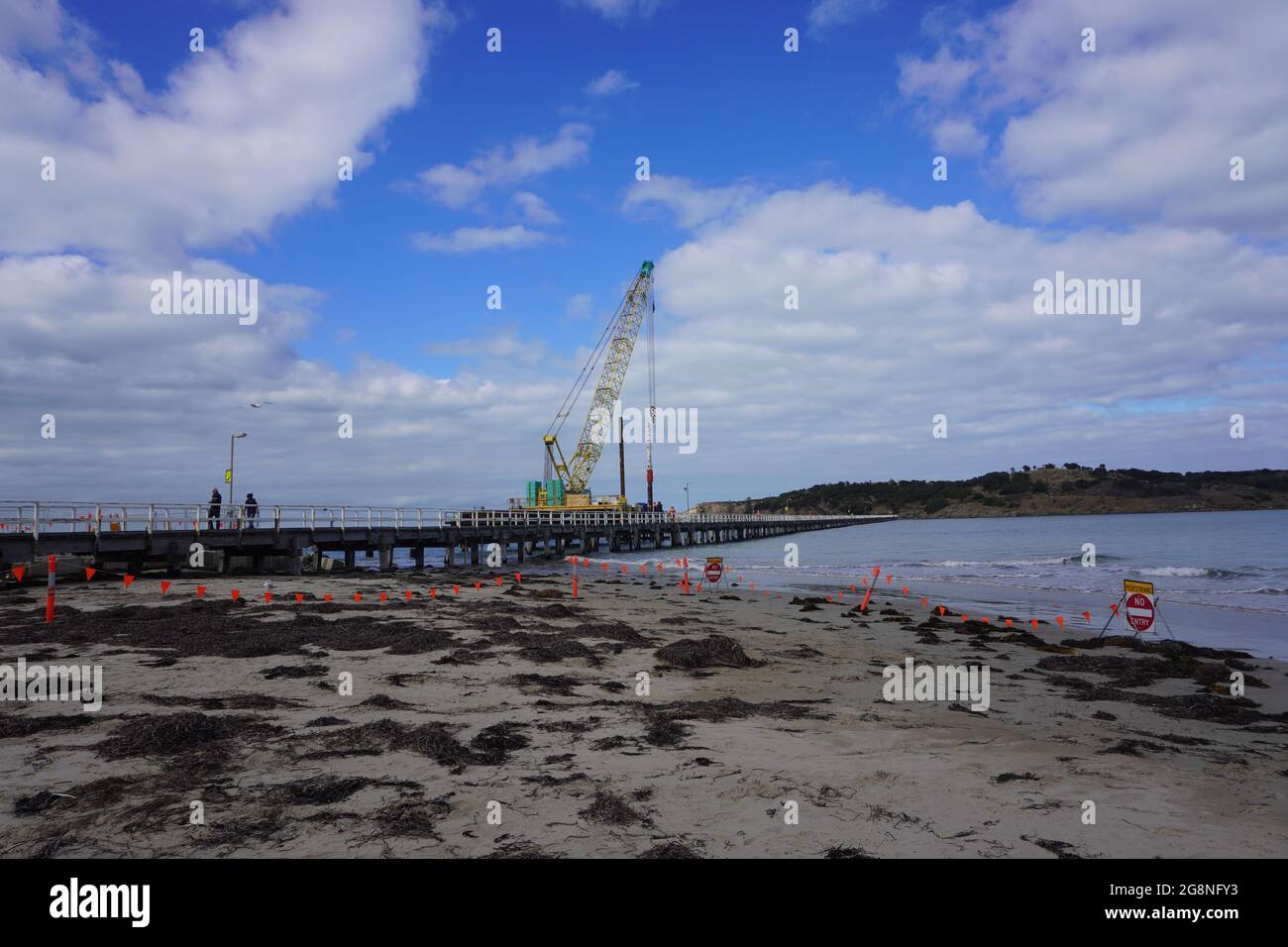 Construction Crane engaged in building a new Causeway beside the Old ...