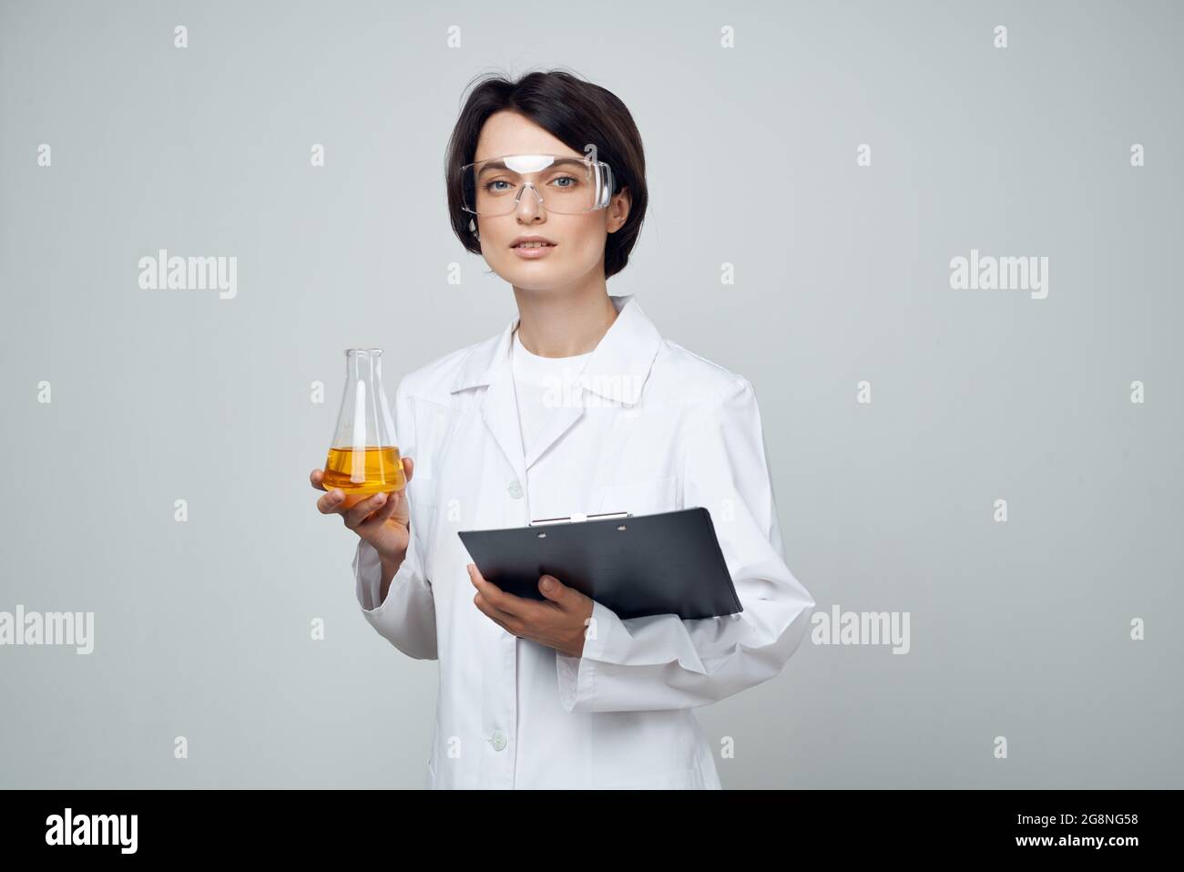 woman scientists chemical solution analysis diagnostics professional ...