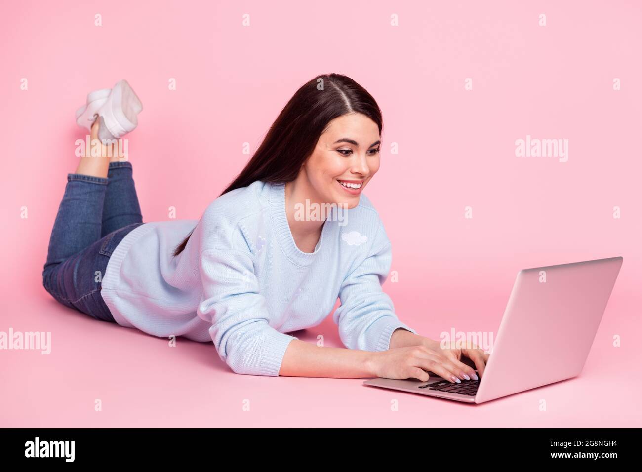 Full size photo of nice optimistic brunette hairdo lady lie work laptop ...