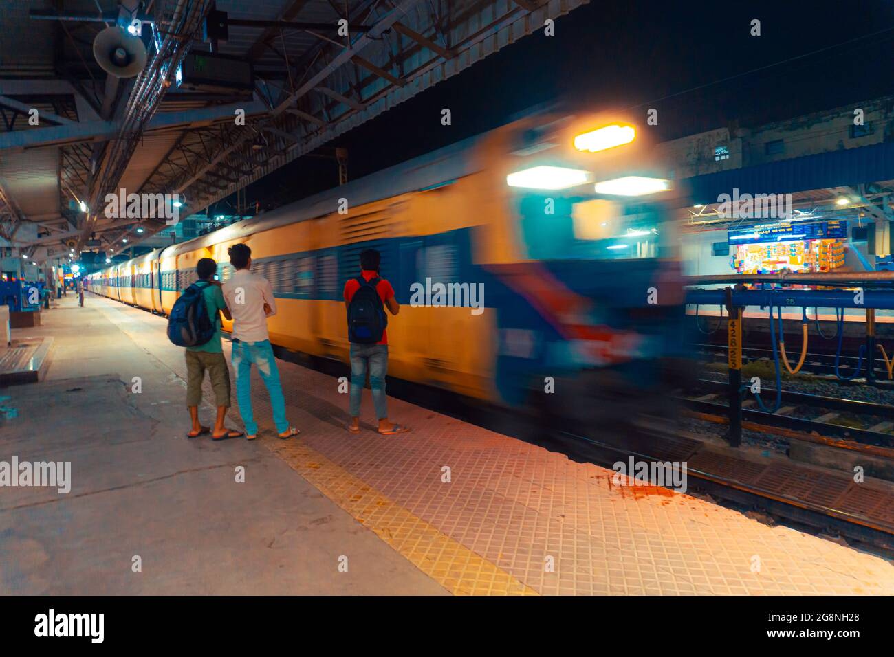 Train arriving at the station Stock Photo - Alamy