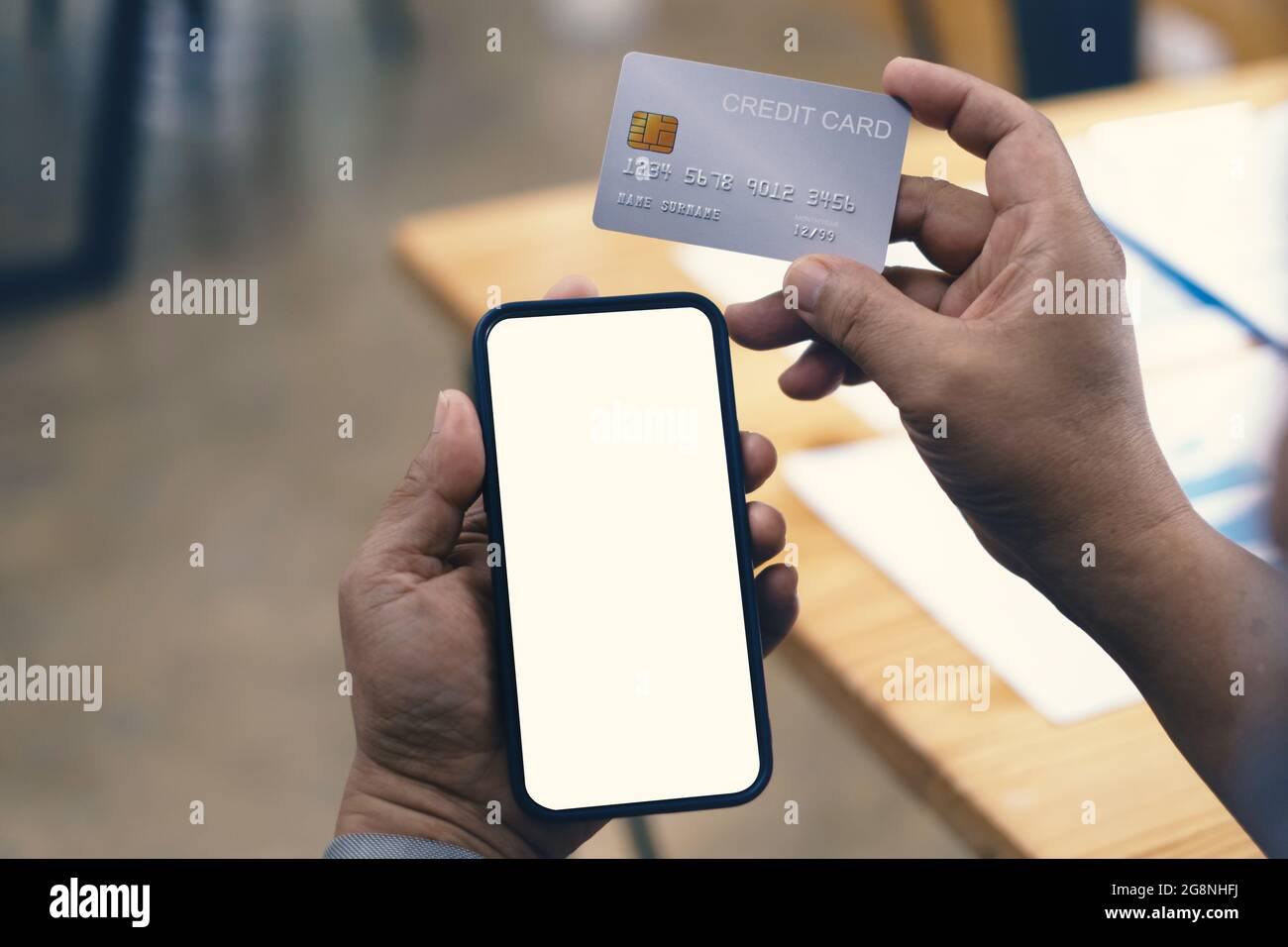 Hands holding smartphone blank screen and credit card Stock Photo - Alamy