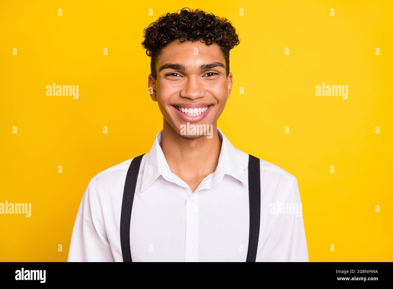 Photo portrait of african american guy smiling isolated on vivid yellow ...