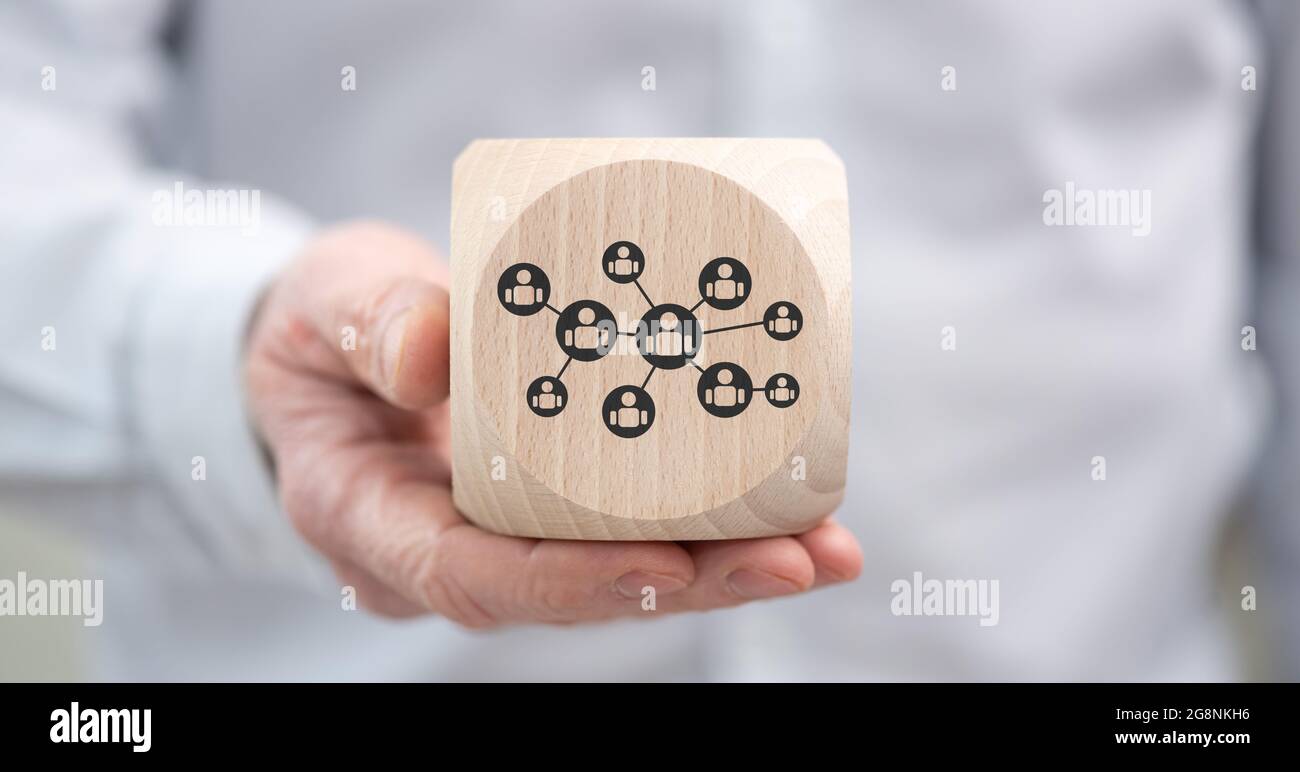 Hand holding a wooden cube with symbol of social network concept Stock ...