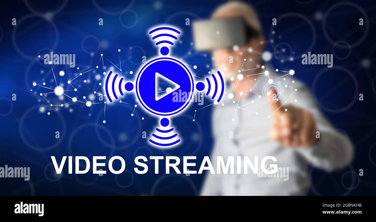 Man with vr headset touching a video streaming concept on a touch ...