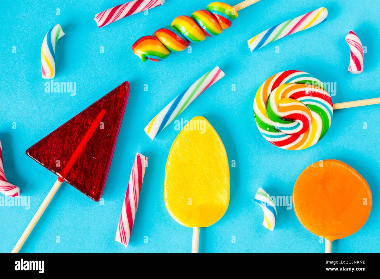 Colorful candies, lollypop on the blue color background, multicolored ...