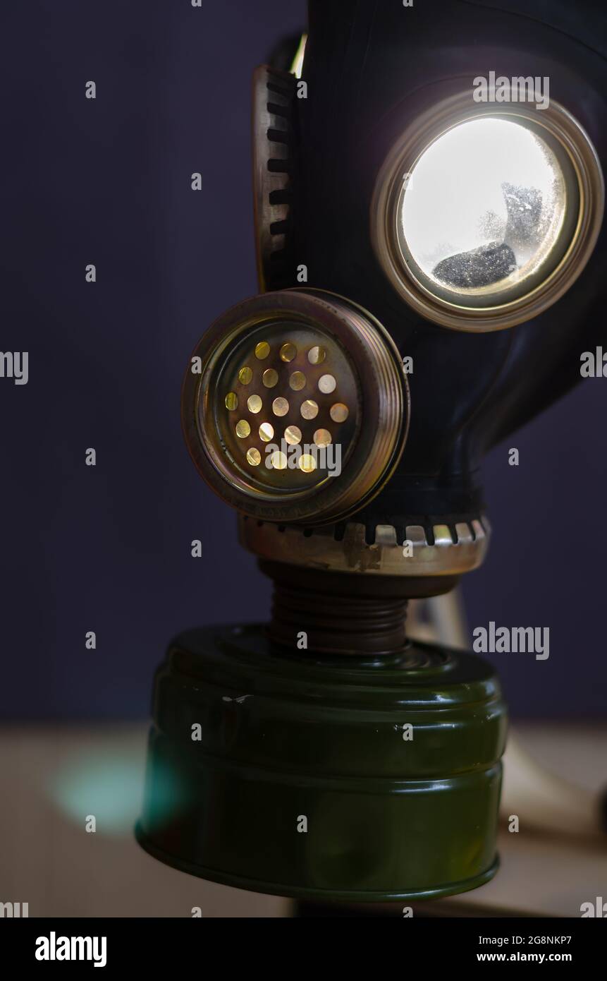 Abstract composition with a gas mask glowing from inside. Military gas ...