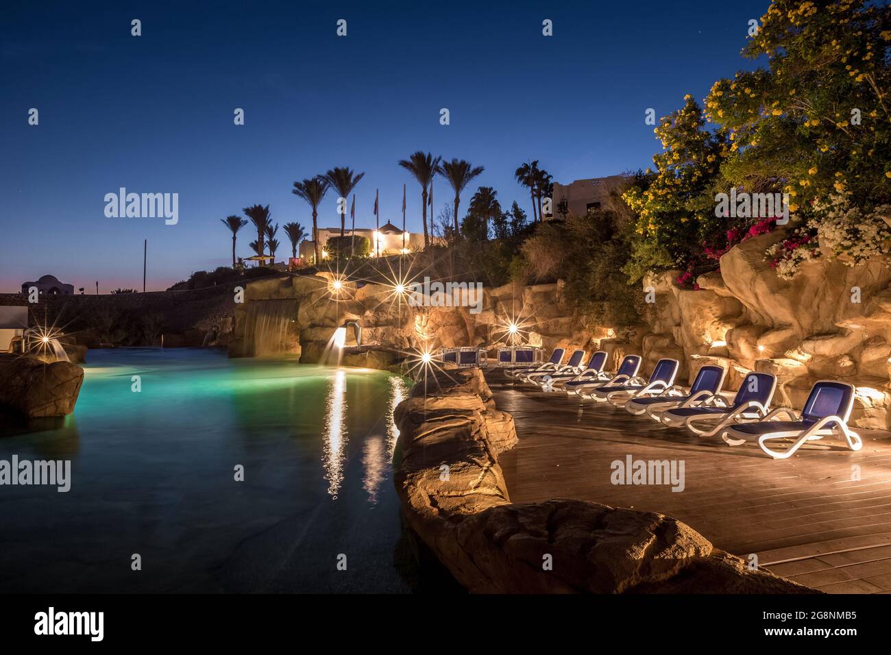 Long exposure shot of swimming pool at luxury night illumination Stock ...