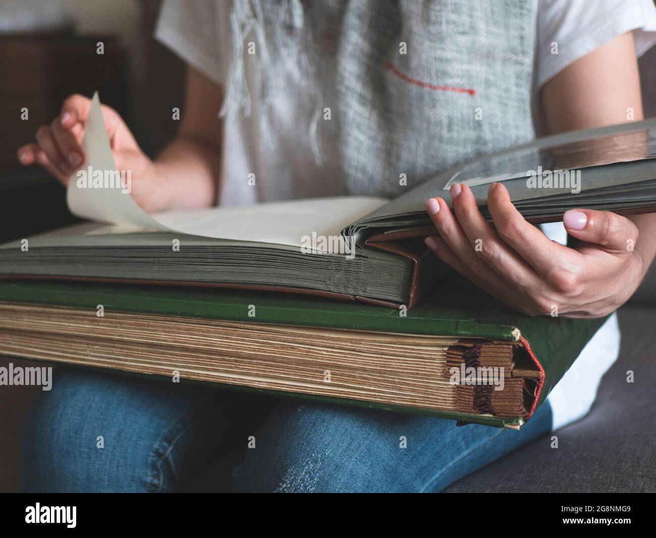 Looking at some old pictures in a photo album hi-res stock photography ...