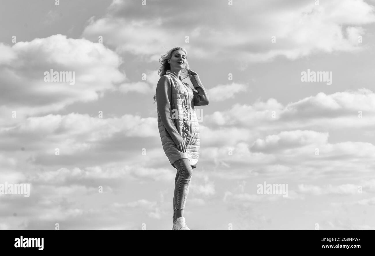 Beauty and fashion, look. concept of loneliness. woman on blue sky ...