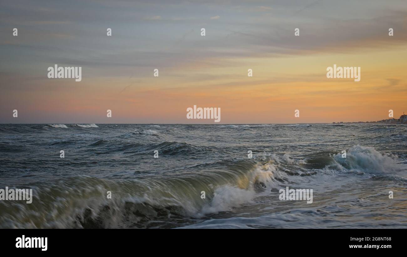 Ocean waves overcast sky dusk hi-res stock photography and images - Alamy