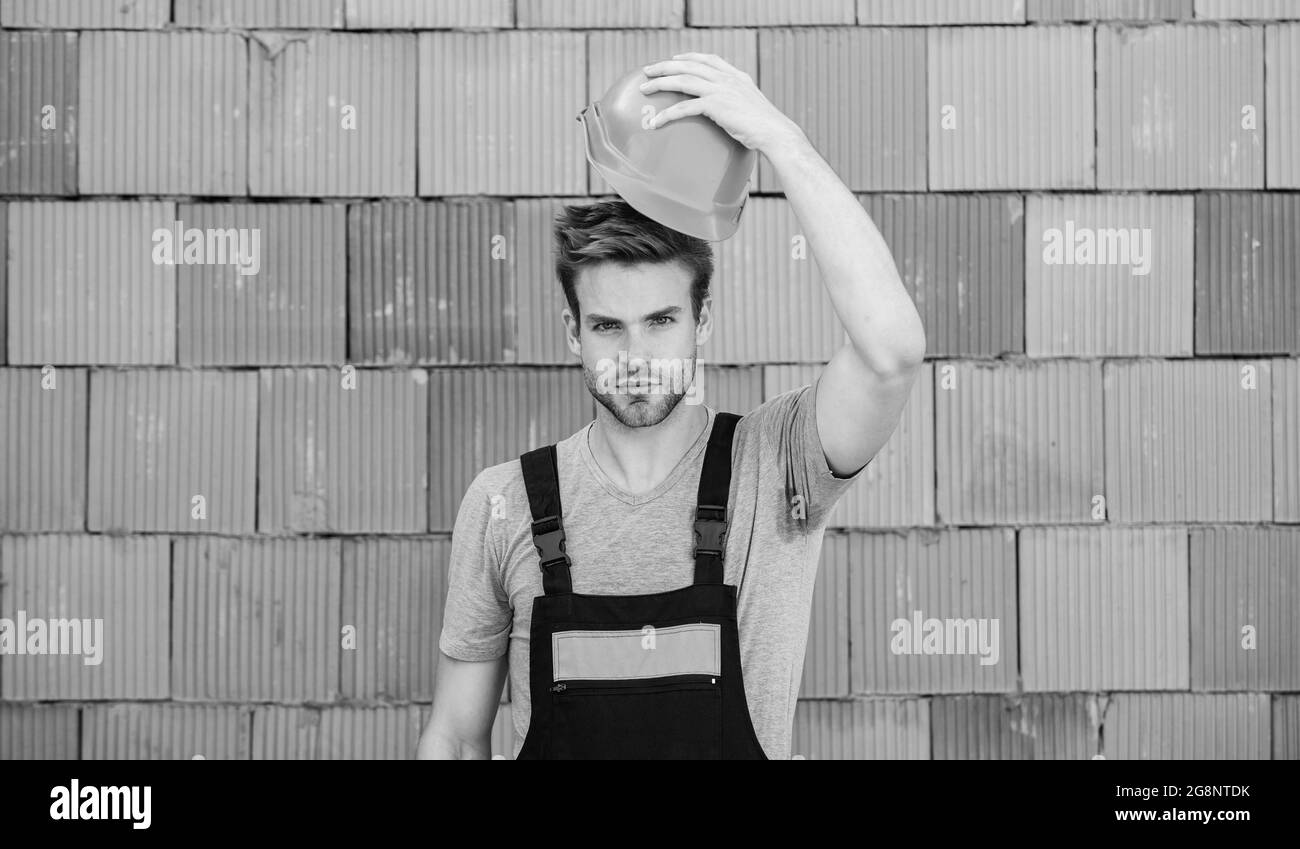 Worker brick wall background. Building construction. General ...