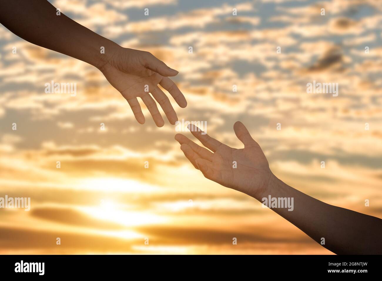 Helping hand sky background hi-res stock photography and images - Alamy