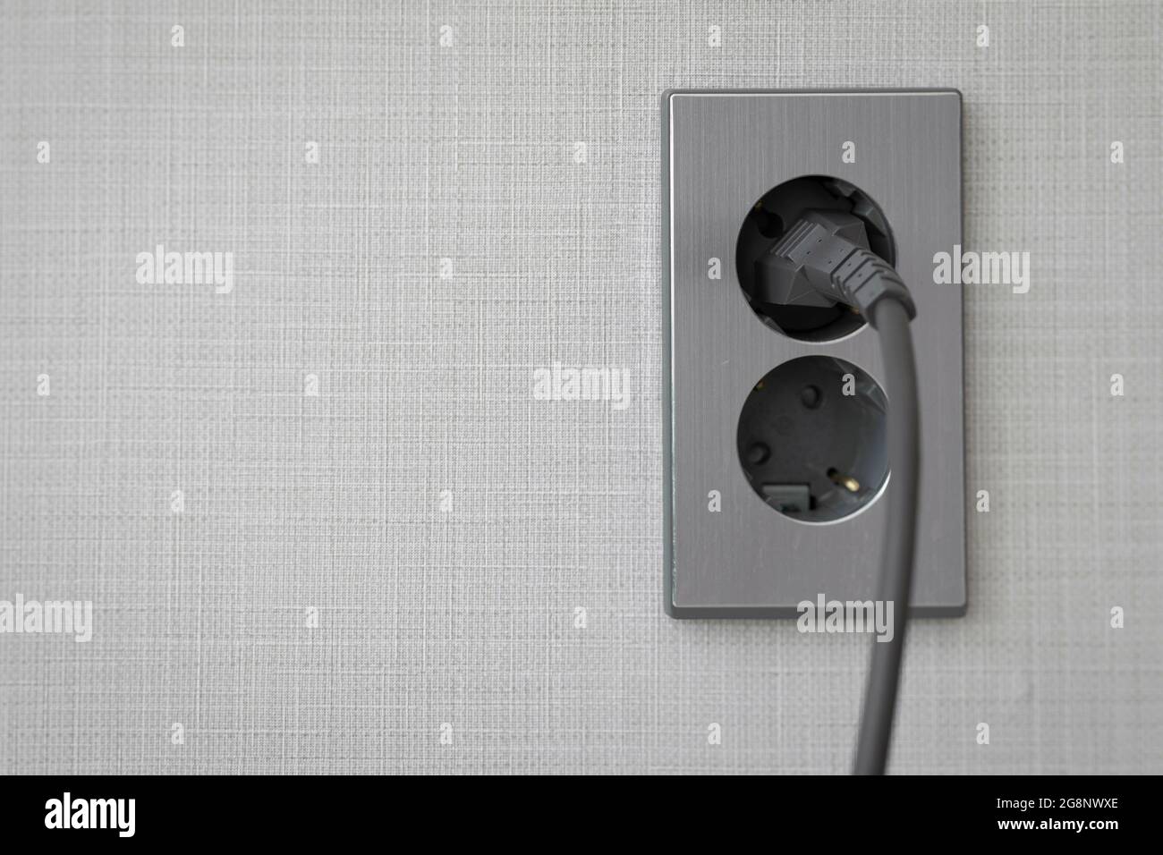 plugged power socket, outlet Stock Photo - Alamy