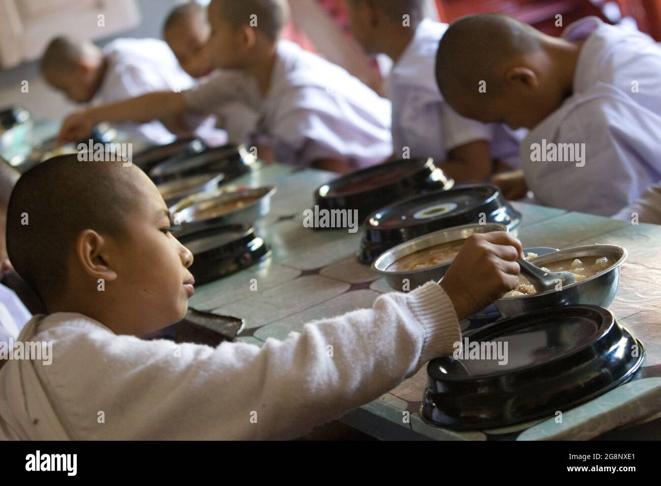 Young monks lunch time in Mahagandhayon Monastery, Mandalay, Myanmar ...