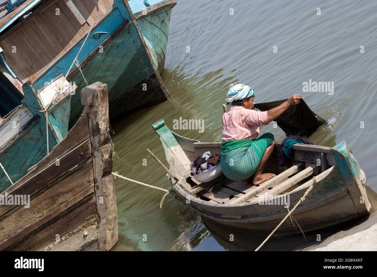 Woman washing clothes in the Ayearwady river, Mingun, Sagaing Region ...