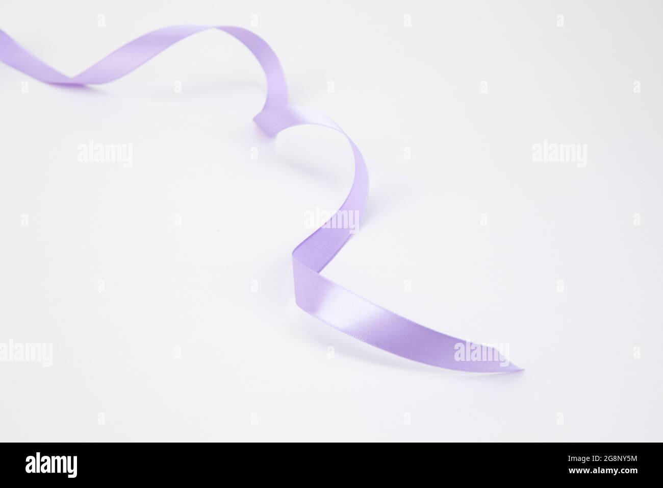 purple ribbon on white background Stock Photo - Alamy